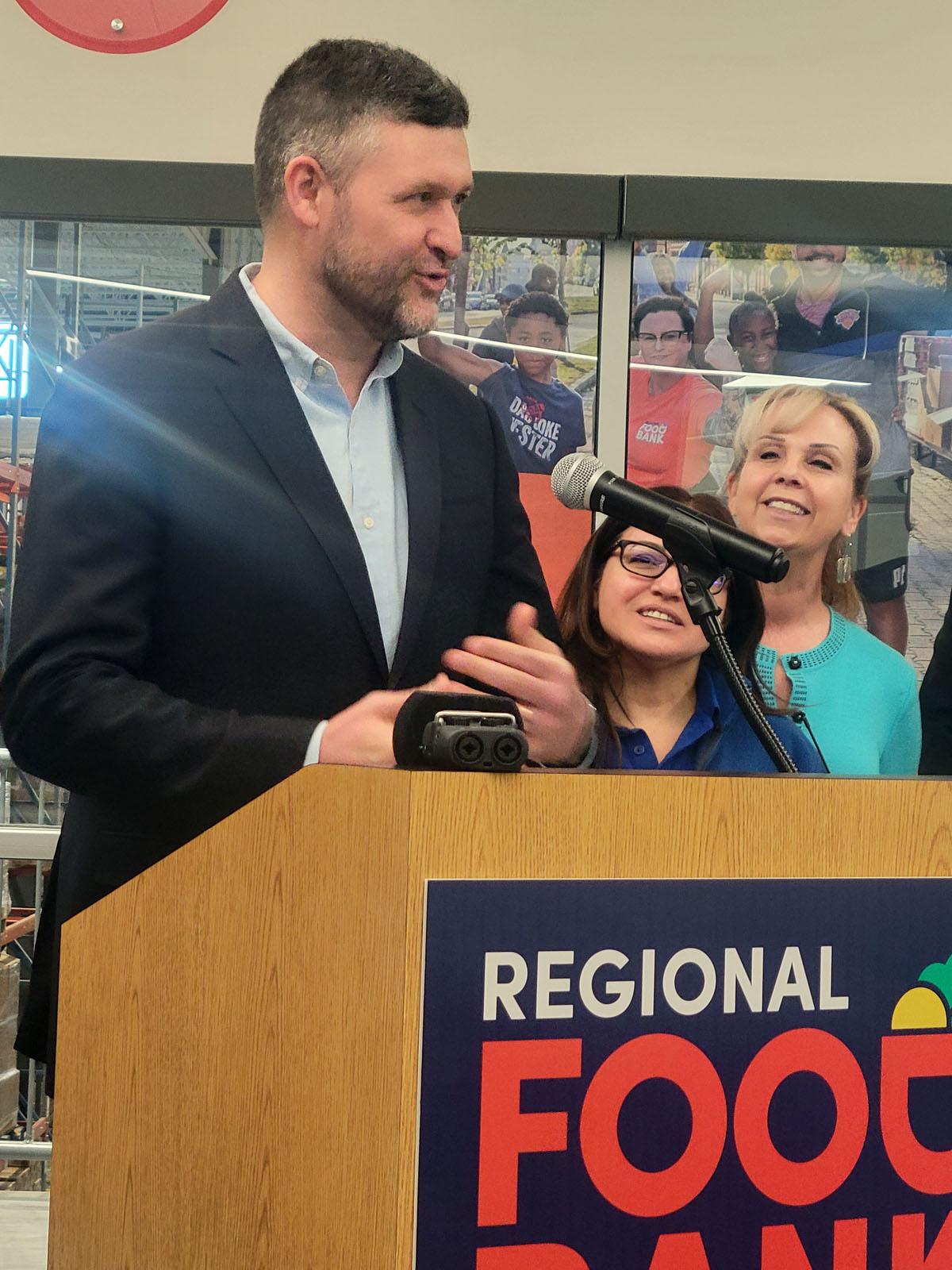 Community rallies to protest cuts to food bank funding