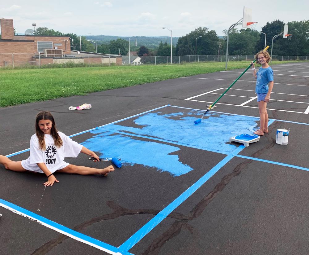 Goshen. Girl Scouts paint the Goshen Intermediate School recess area ...